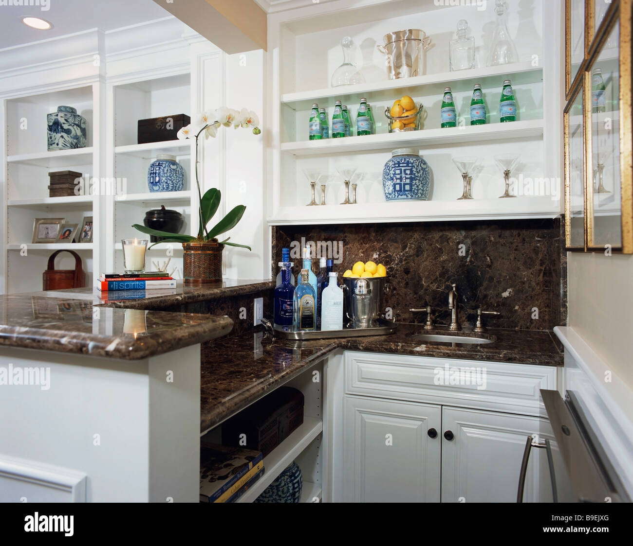 Small wet bar with granite countertops Stock Photo - Alamy