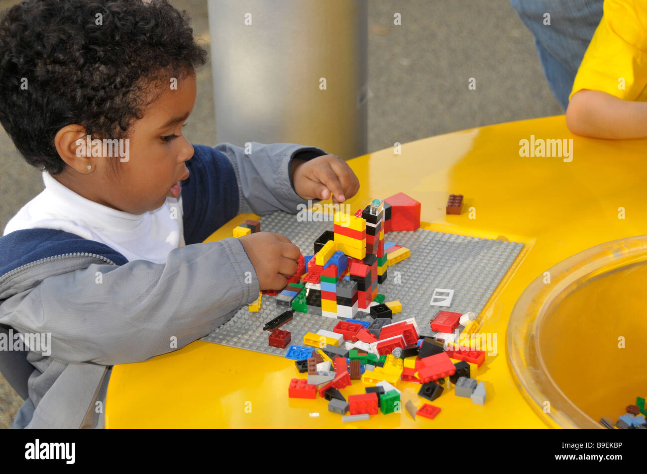 African American boy plays with Legos at Downtown Disney Orlando ...