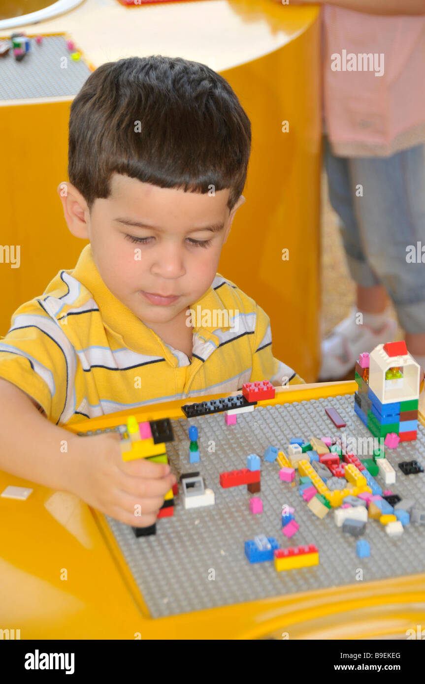 Hispanic Boy plays with Legos at Downtown Disney Orlando Florida Stock ...