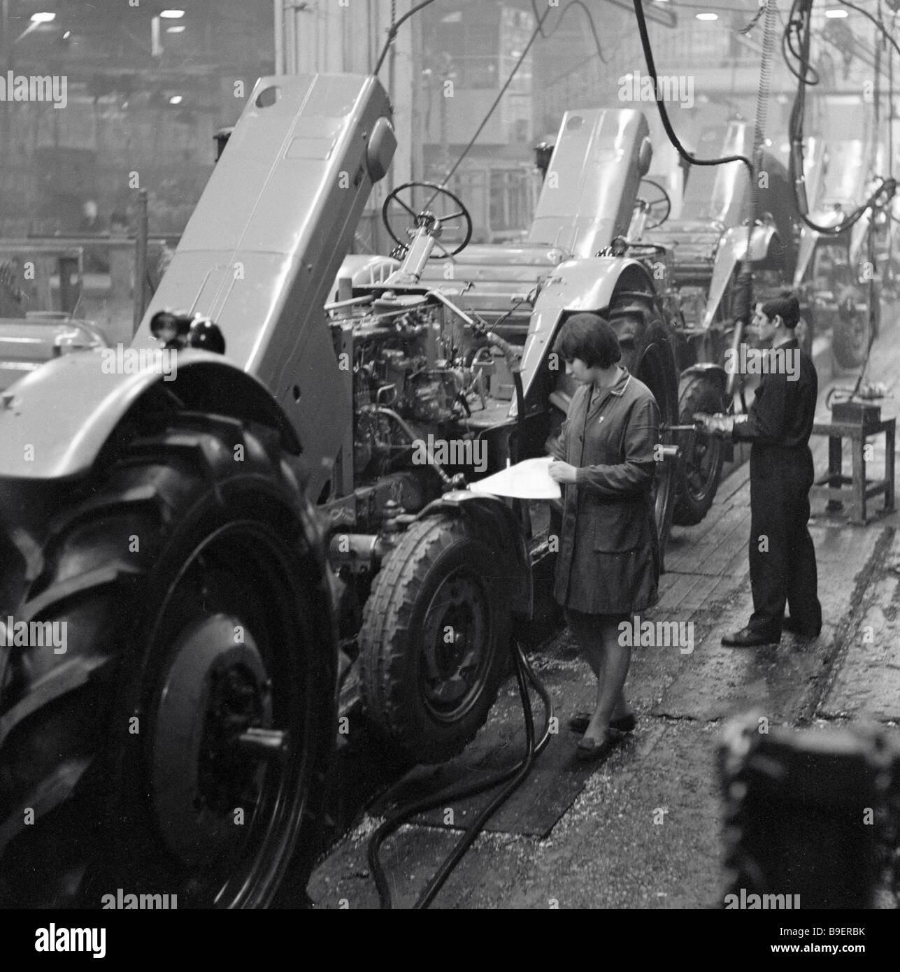 Assembling MTZ 50 tractors on the main conveyor of the Minsk tractor ...