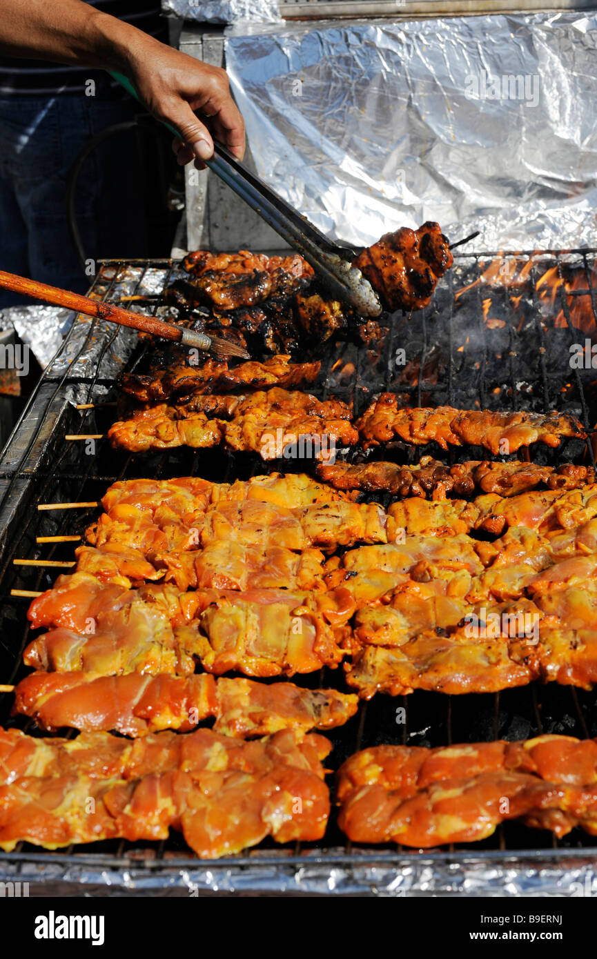 Barbecue marinated chicken on grill at food booth Eola Park Orlando ...