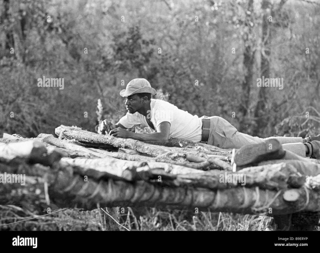Mozambican guerilla planting mines for Portuguese trucks not to pass ...