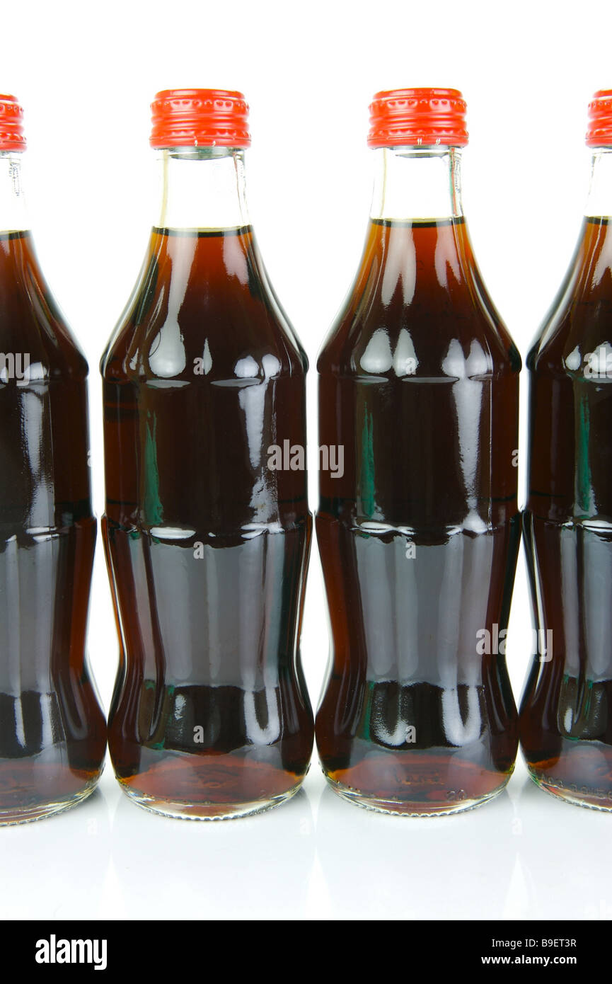 Cola bottles isolated against a white background Stock Photo - Alamy