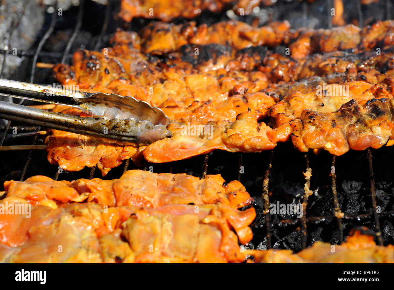 Barbecue marinated chicken on grill at food booth Eola Park Orlando ...
