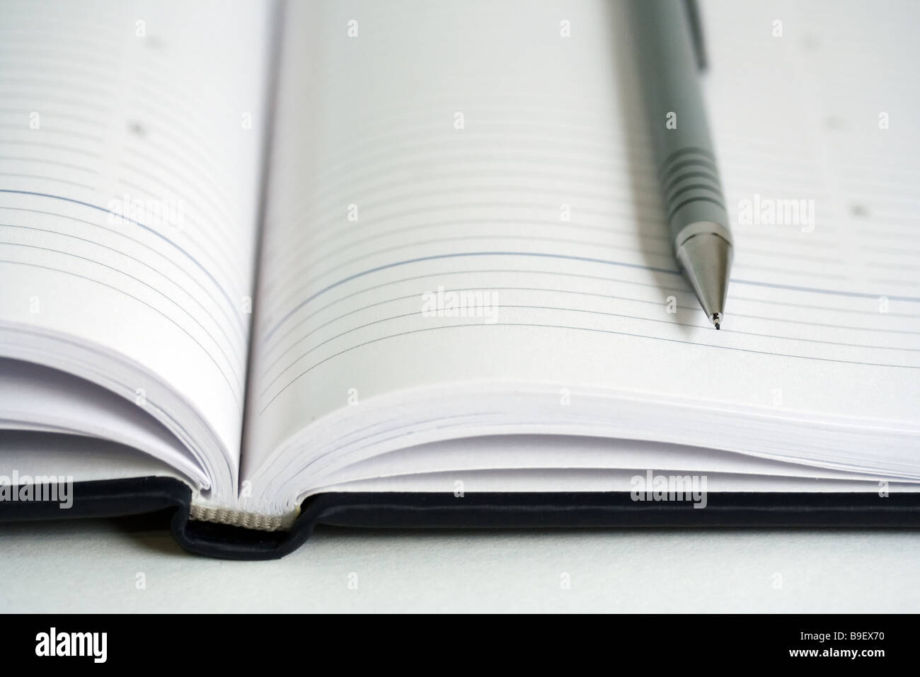 Notebook and ballpoint pen Stock Photo - Alamy
