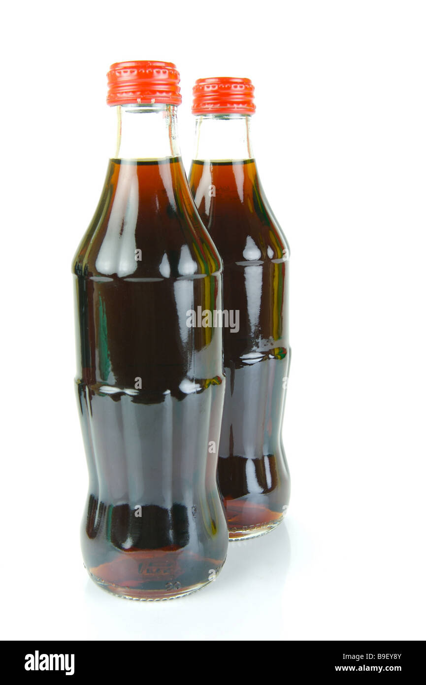 Cola bottles isolated against a white background Stock Photo - Alamy