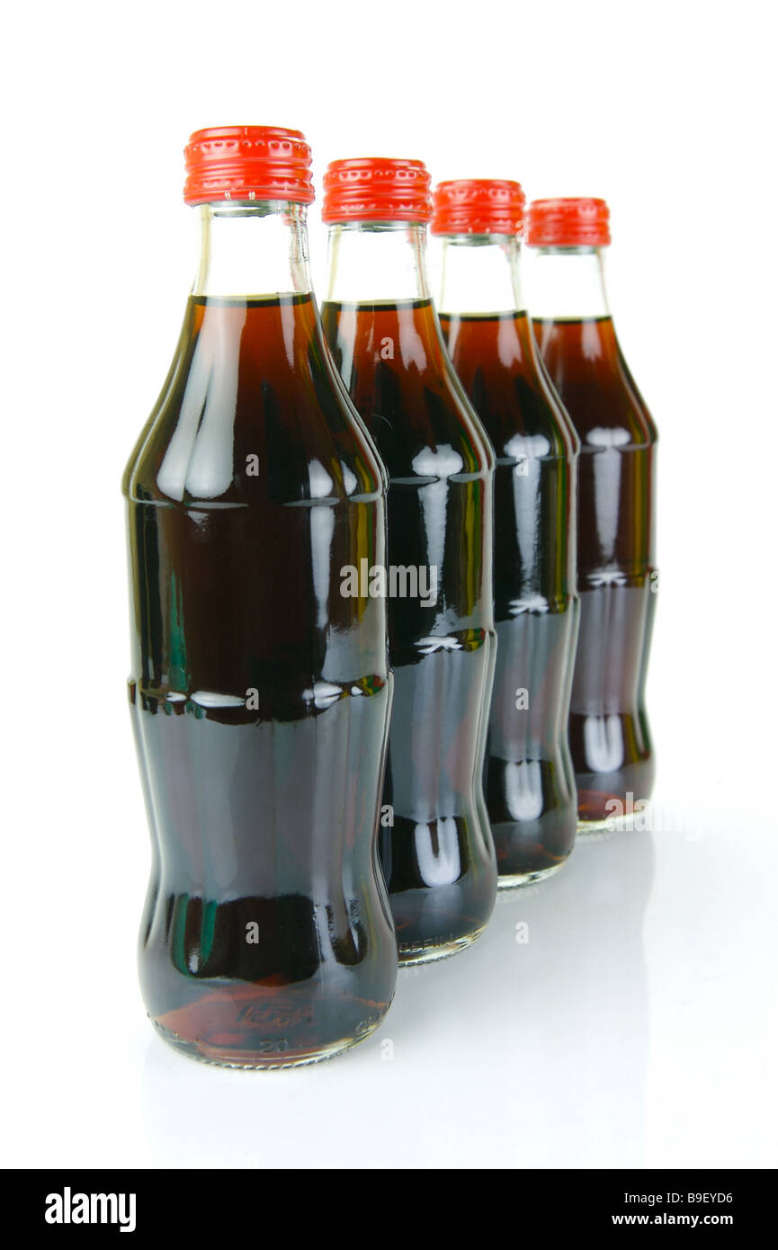 Cola bottles isolated against a white background Stock Photo - Alamy