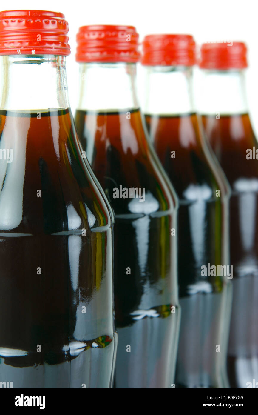 Cola bottles isolated against a white background Stock Photo - Alamy