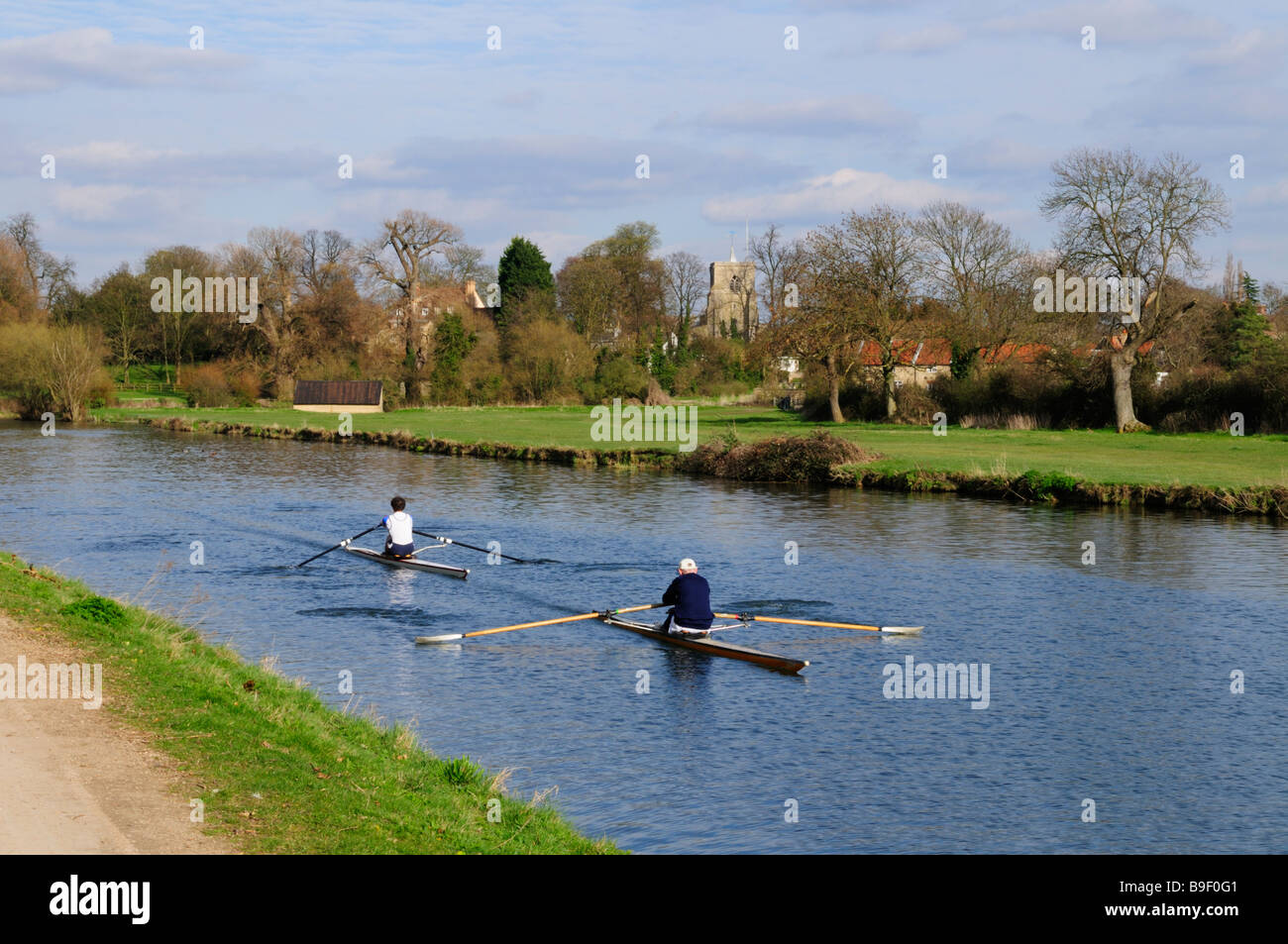 Two scullers on the River Cam at Fen Ditton cambridgeshire England UK ...