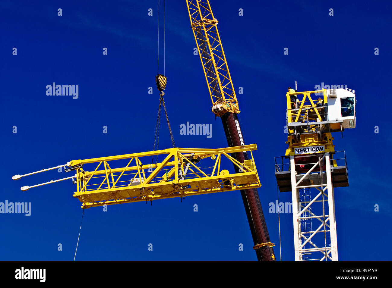 Construction Industry / A tower crane is being assembled in sections ...
