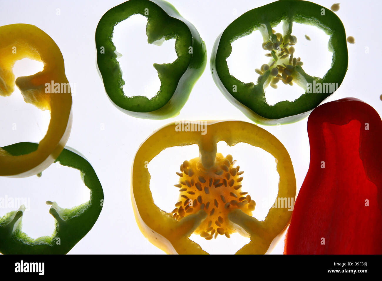 Red, green and yellow bell pepper rings on white background Stock Photo ...