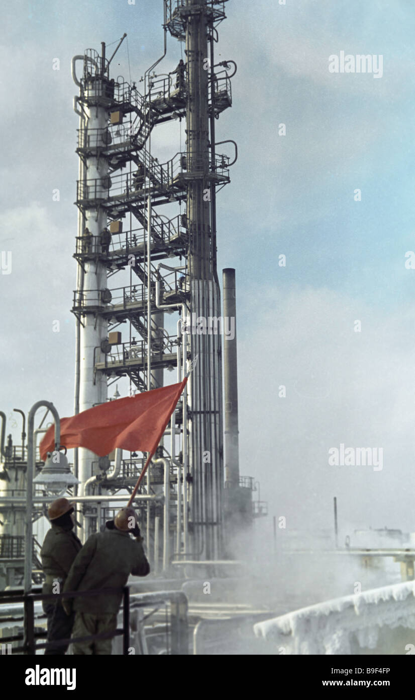 People placing red flag at construction site Stock Photo - Alamy