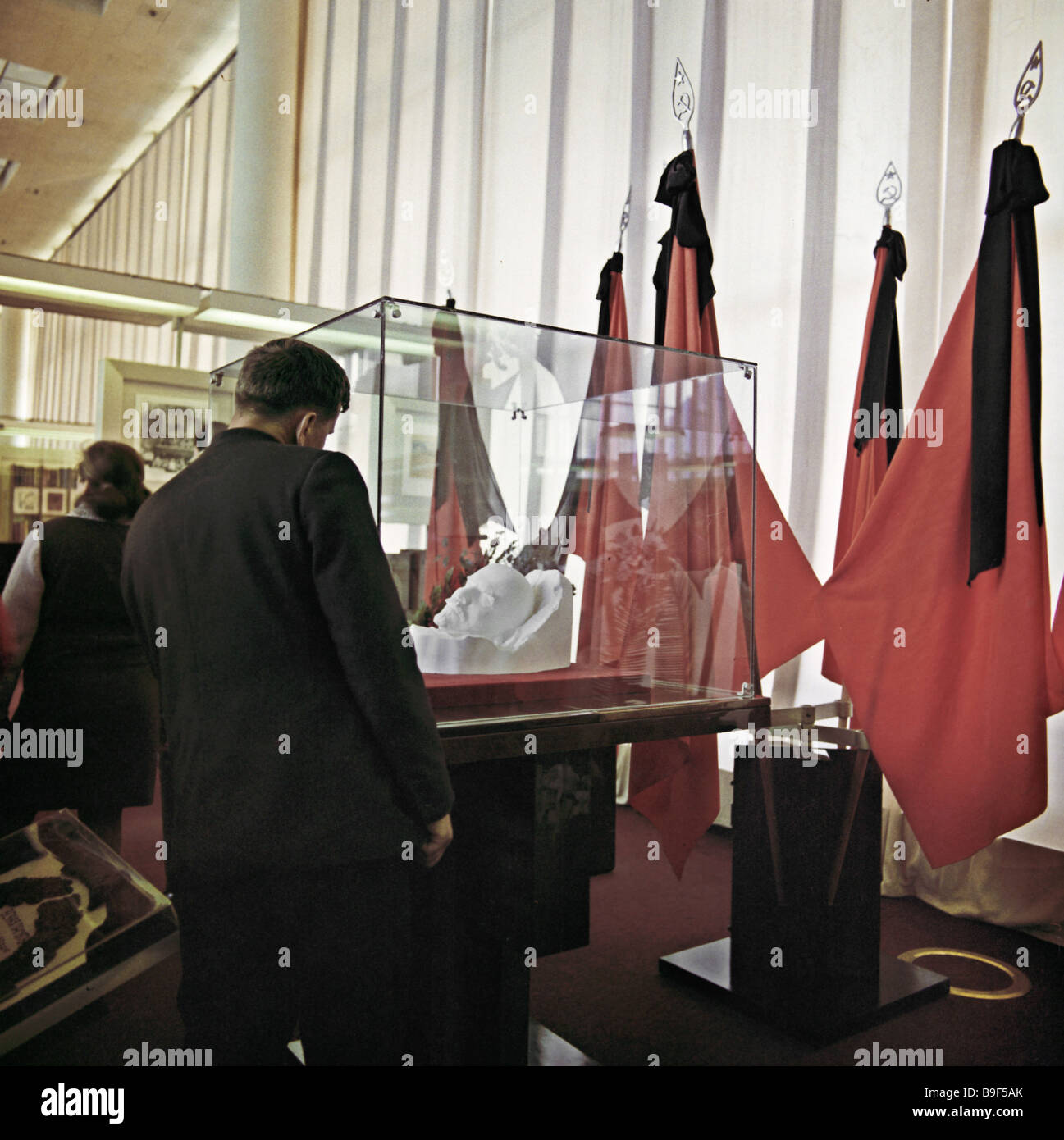A visitor of the Lenin memorial complex examines Lenin s postmortem ...