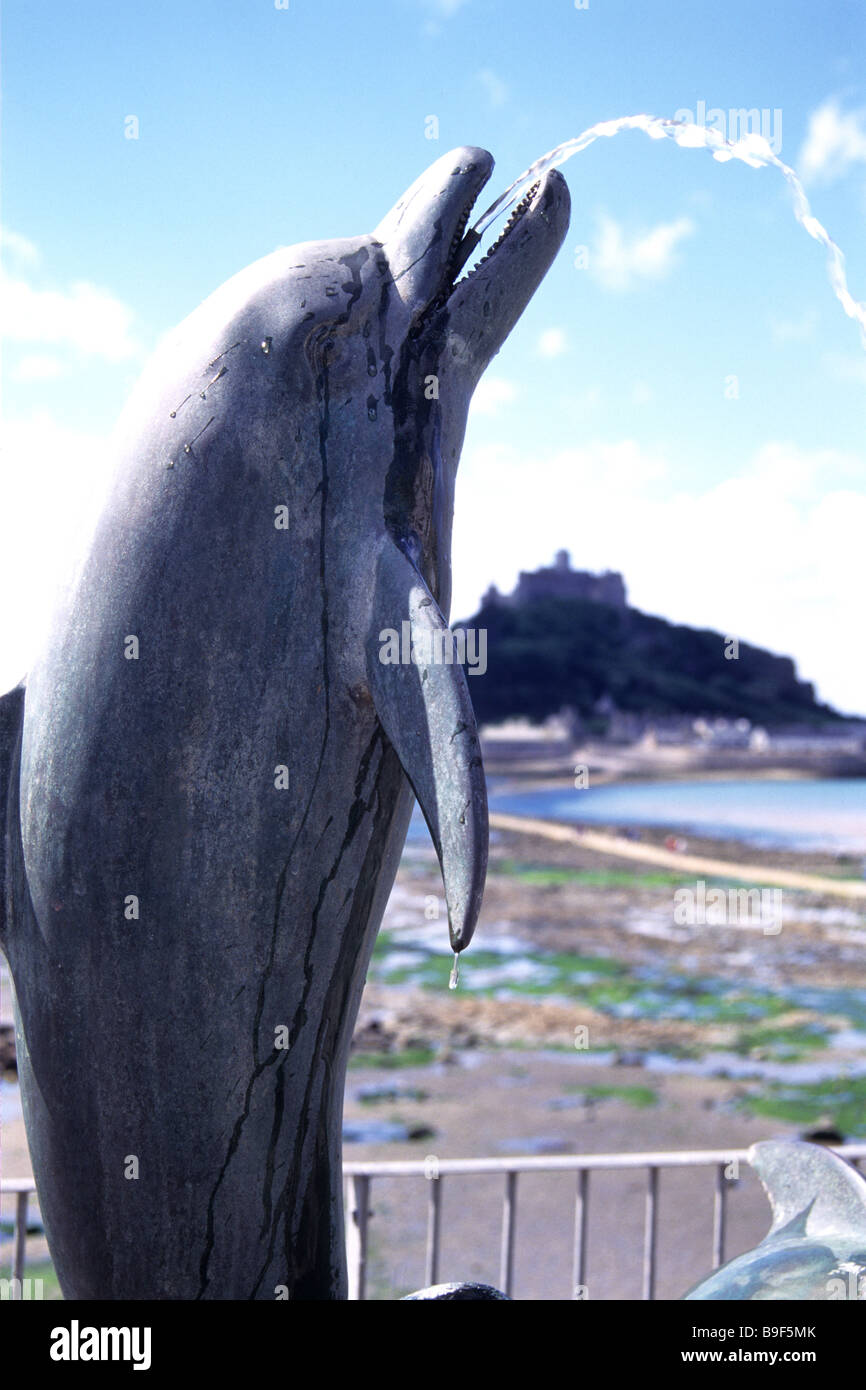 Dolphin sculpture with St Michael's mount, Devon, UK Stock Photo - Alamy