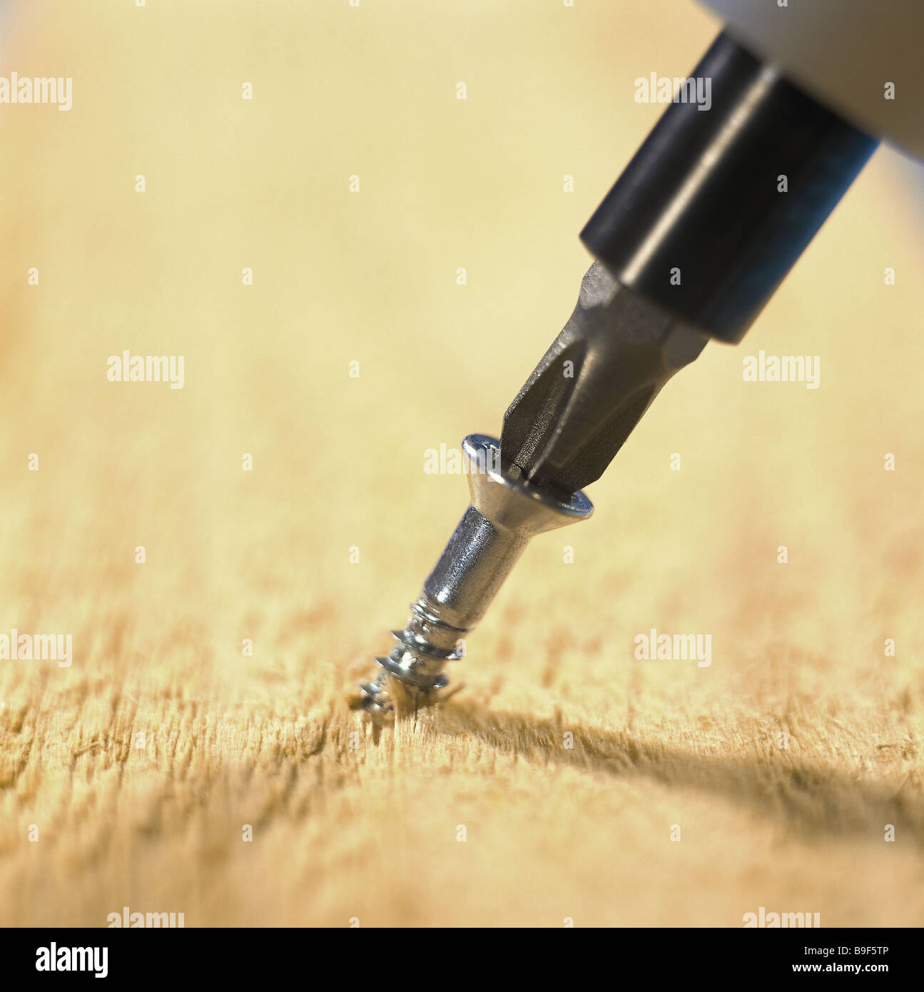 cordless screwdriver one-turns screw wood close-up screws on craft home ...