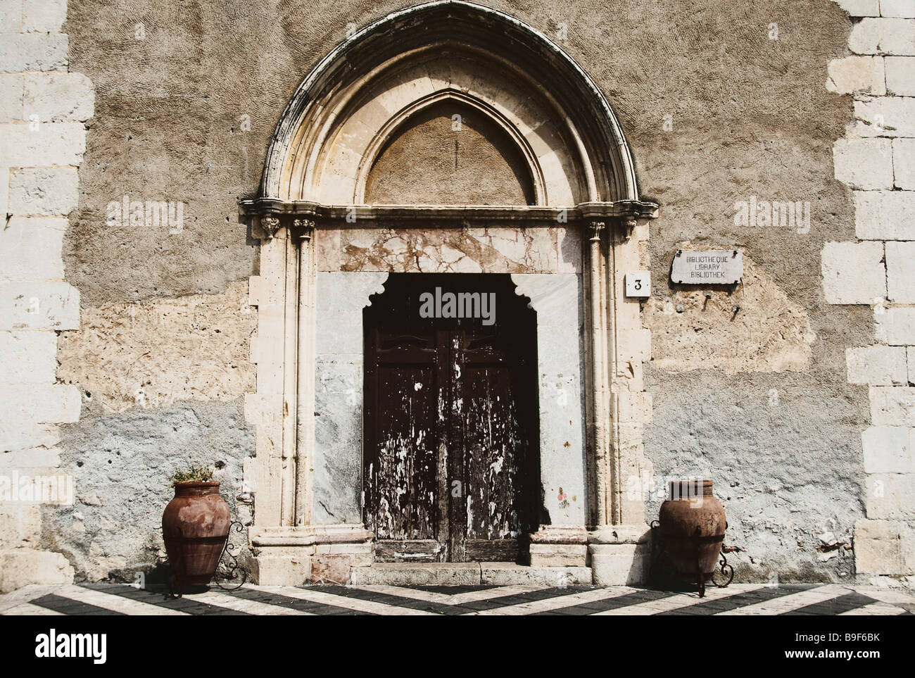 Ancient wooden entrance door to the library in Tamormina, Sicily ...