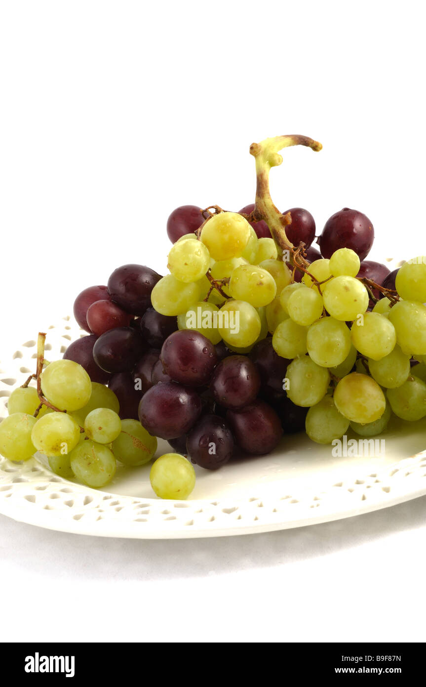 Red and green fresh grapes on white plate Stock Photo - Alamy