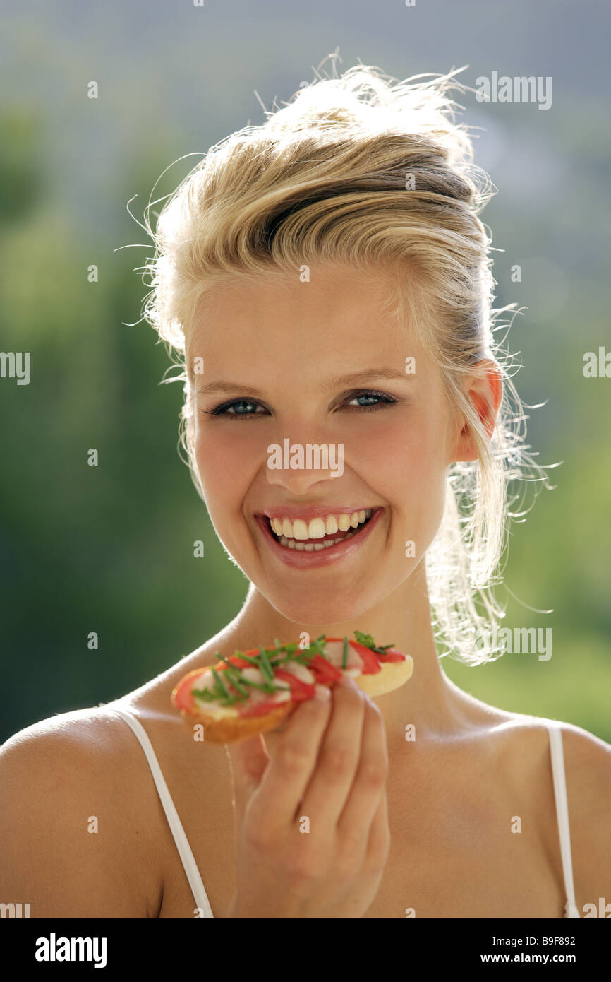 Woman young tomato-bread eating smiling portrait series people blond ...
