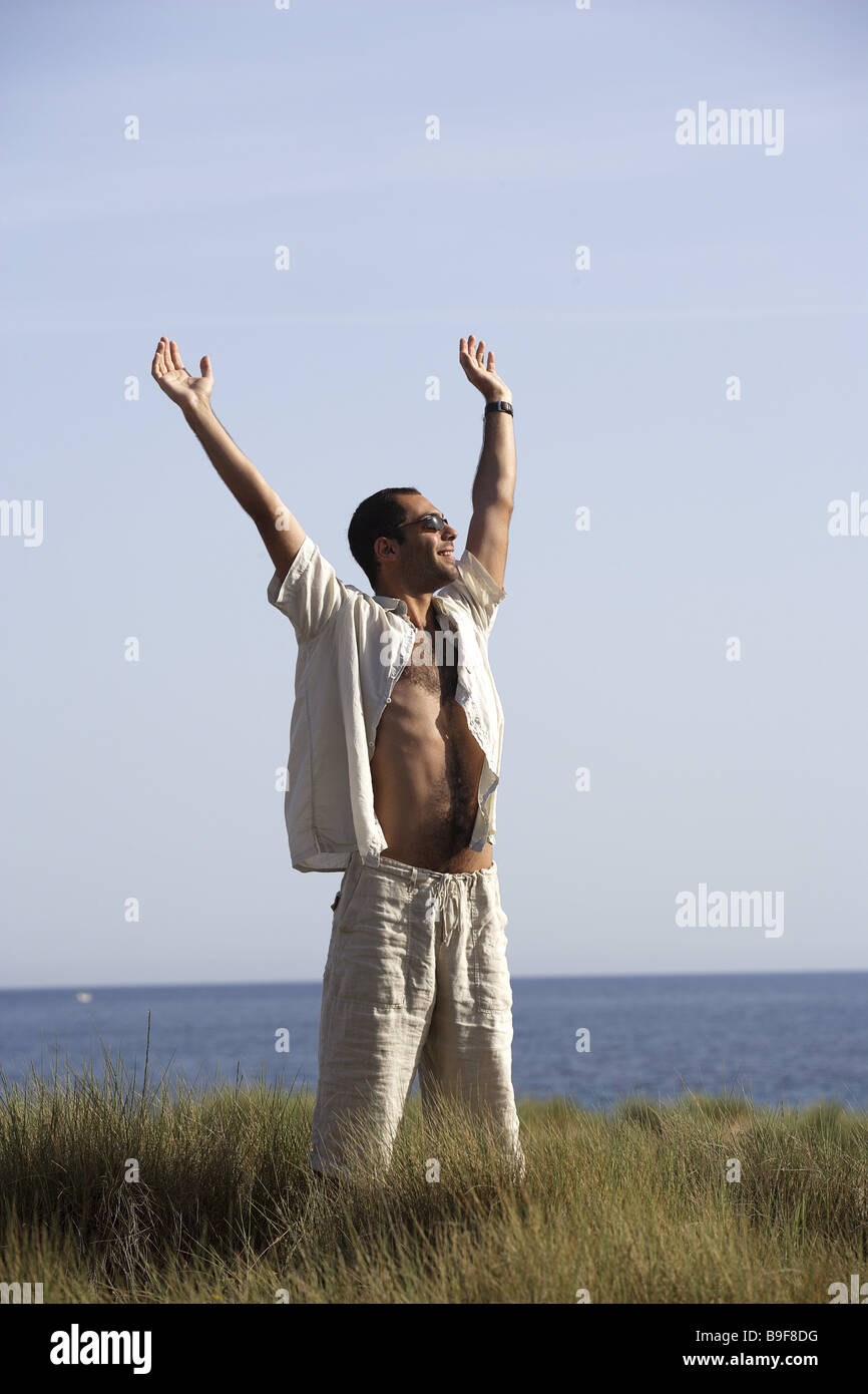 Beach dunes man stands poor detail stretch series people tourist sun ...