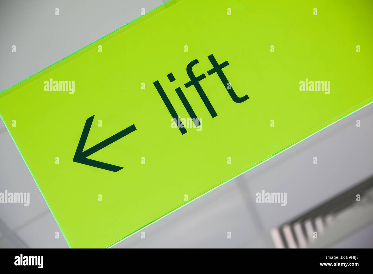 A Shop sign indicating the way to the lifts Stock Photo - Alamy