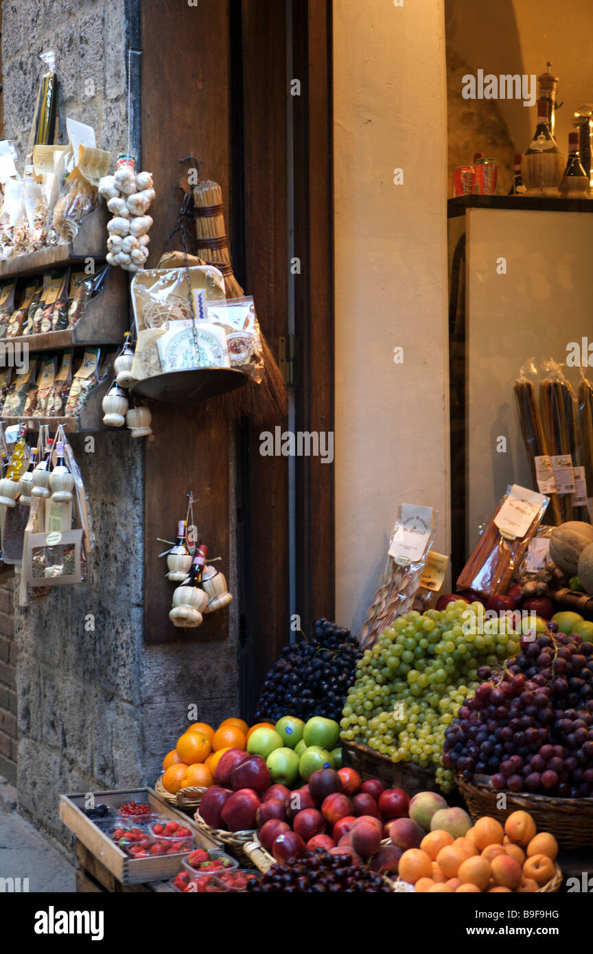 A store shop front in San Gimignano in Tuscany, Italy with fresh and ...