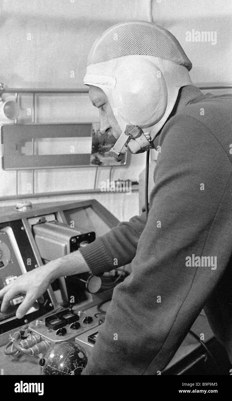Soyuz 9 flight engineer Vitaly Sevastyanov checking the ship s systems ...