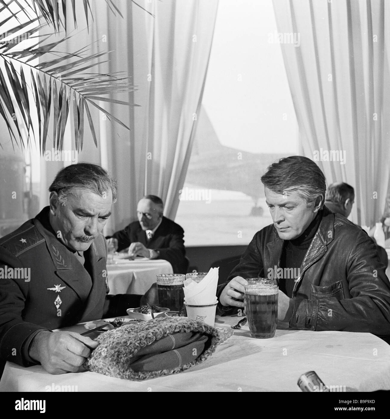 Oleg Strizhenov right as the pilot Yegorov and Pyotr Glebov left in ...