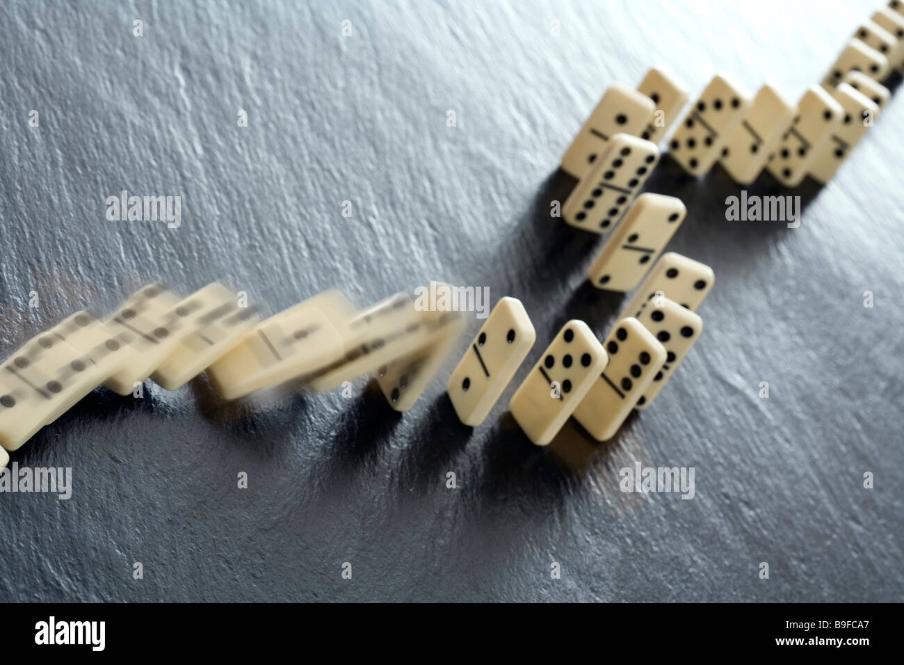Dominos falling hi-res stock photography and images - Alamy