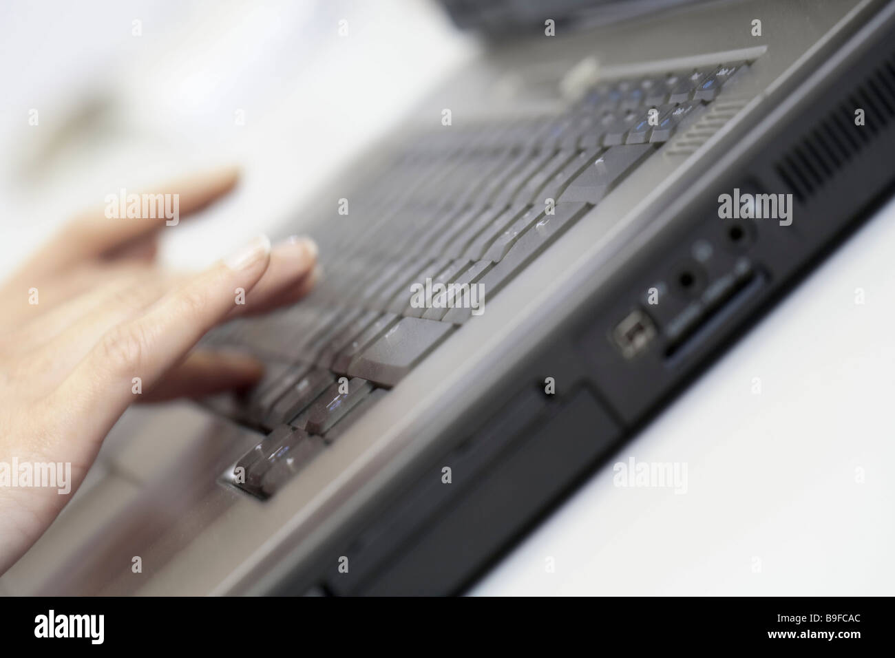 Close-up of woman's hand using laptop Stock Photo - Alamy