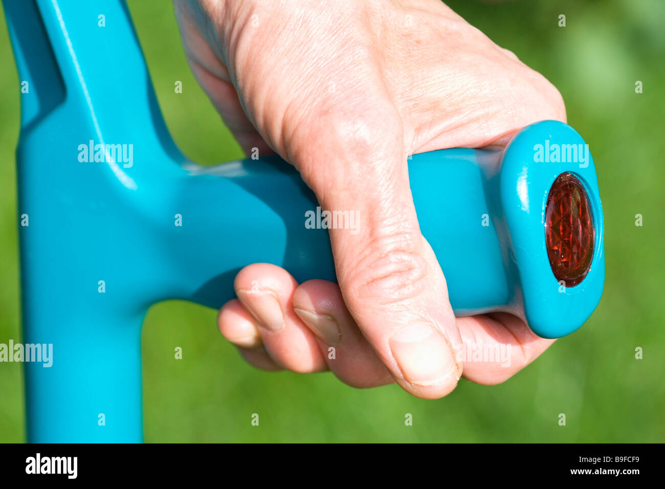 Close-up of person's hand holding crutch Stock Photo - Alamy