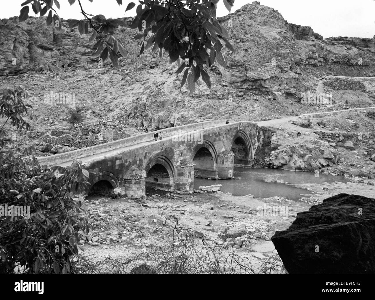 A three arch bridge across The Kasakh River 18th century Stock Photo ...