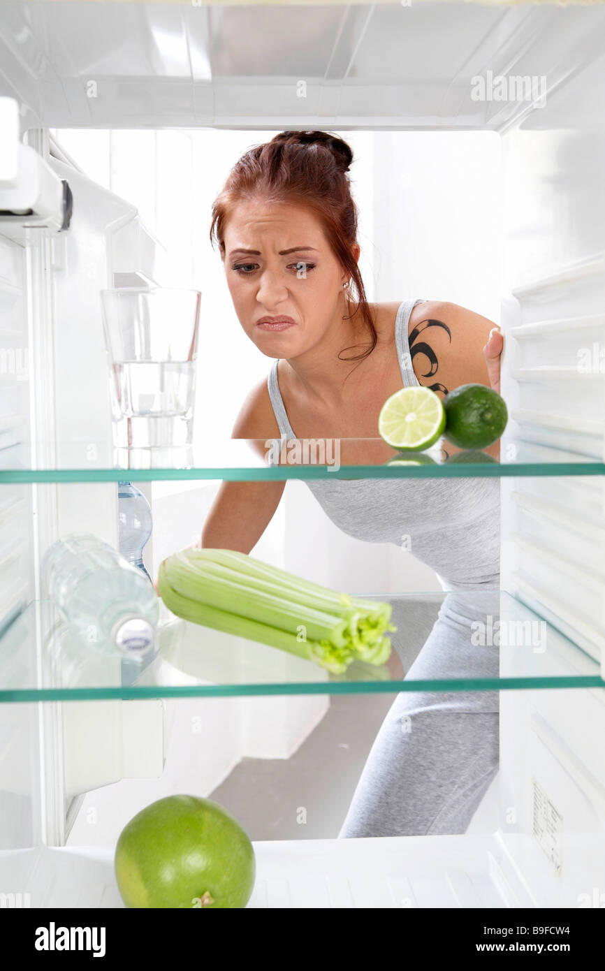 woman looking into an empty cooler Stock Photo - Alamy