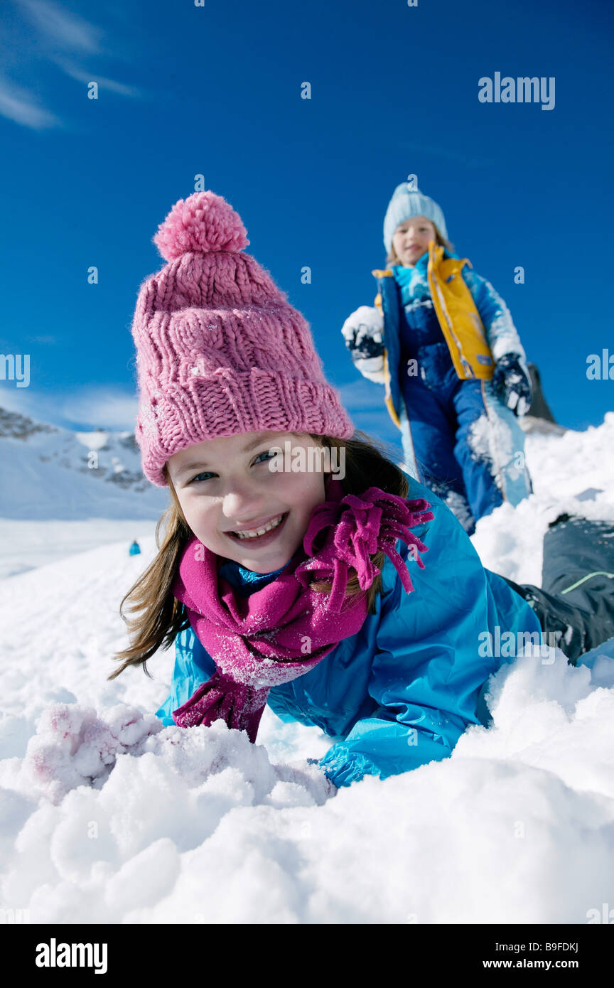 Two children playing in the snow hi-res stock photography and images ...