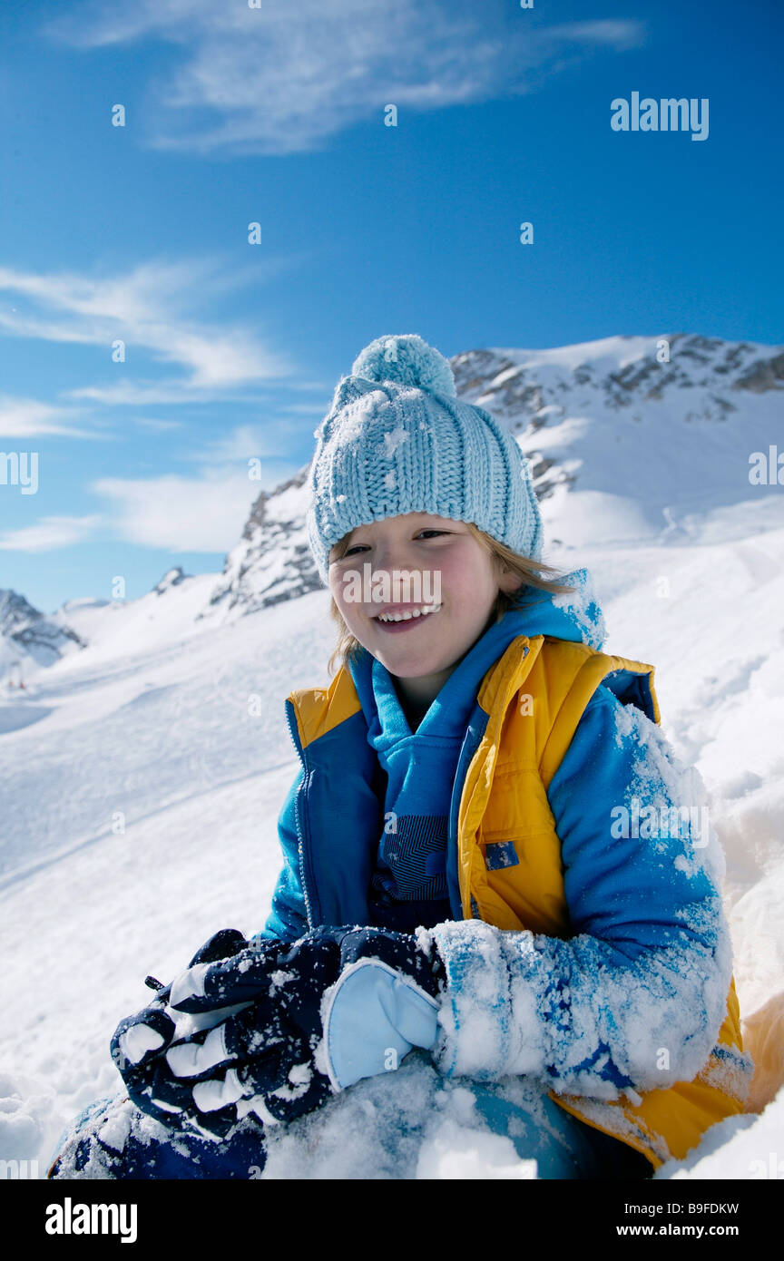 Portrait of boy smiling on snowcovered landscape Stock Photo - Alamy