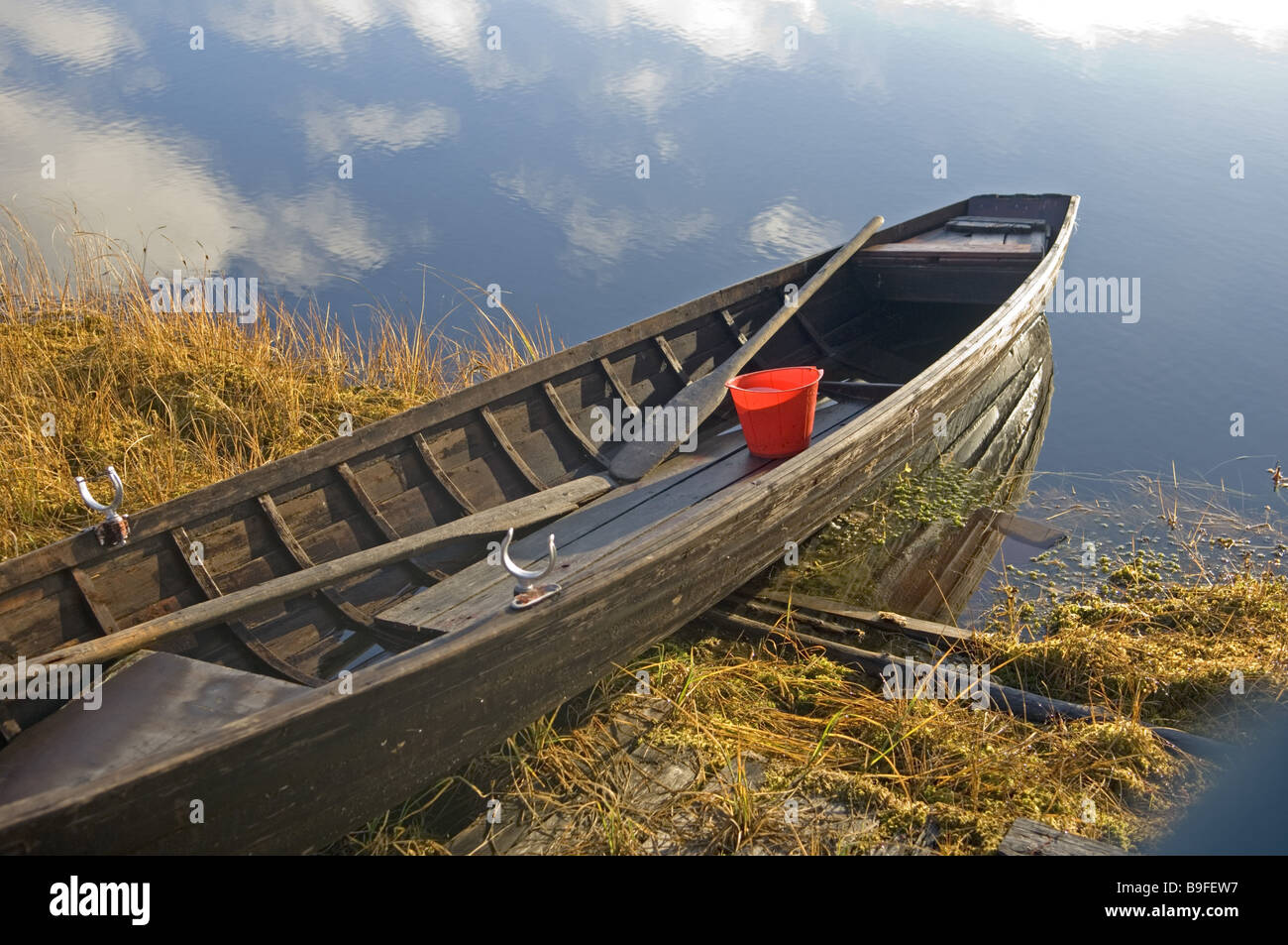 Finland shore rowboat buckets Stock Photo - Alamy
