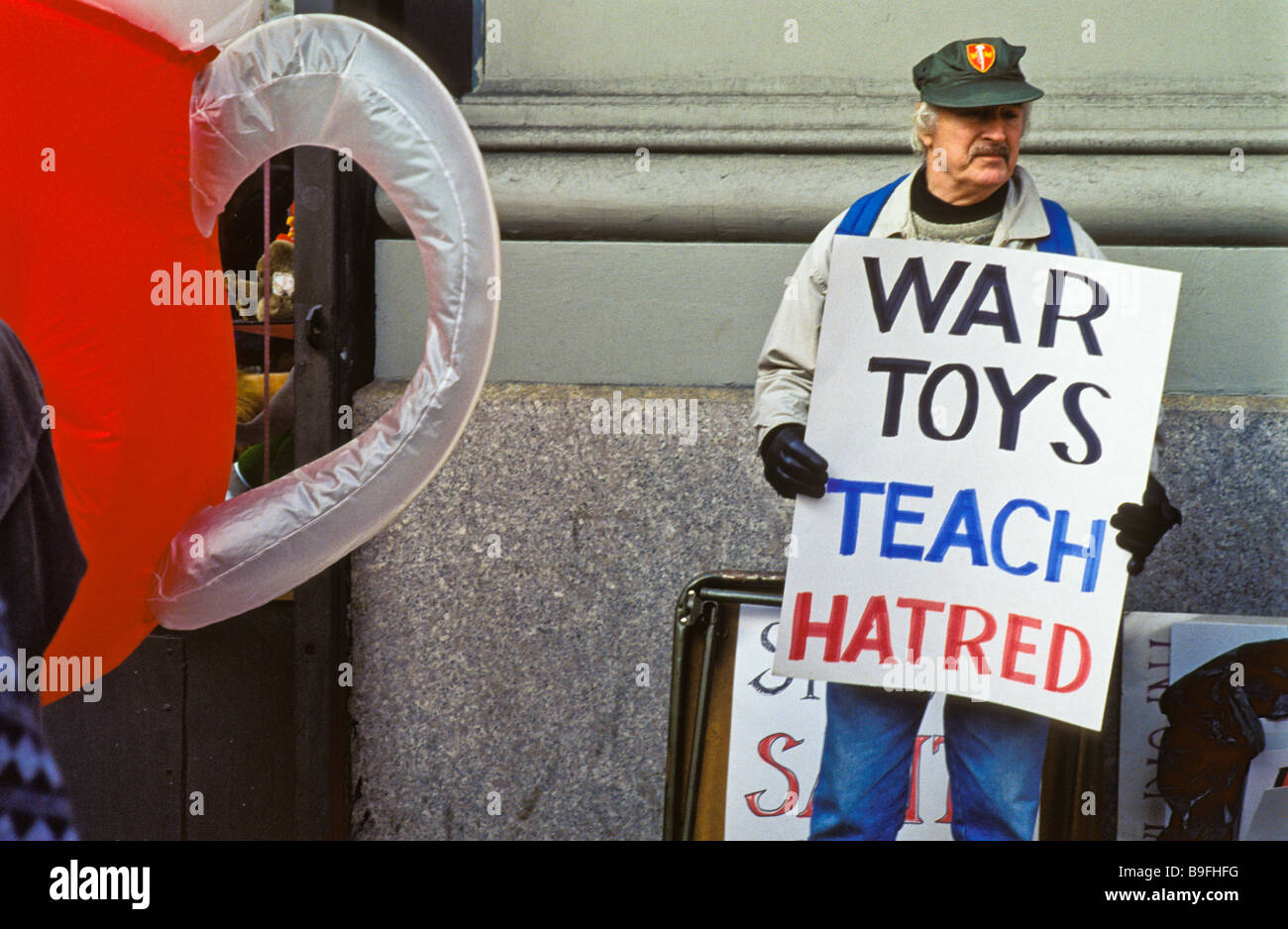 war toys teach hatred sign carying demonstrator at NYC toy fair expo ...