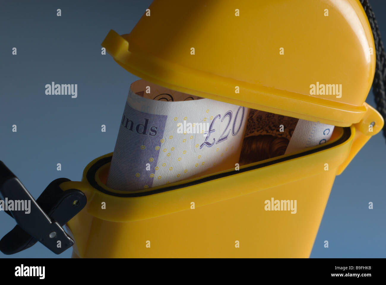 twenty pounds in a waterproof money container on a blue background ...