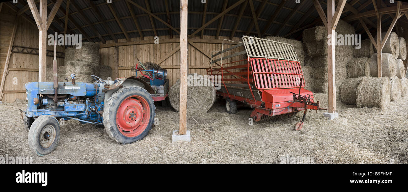 Tractor drawer-cars bale of straw barn Stock Photo - Alamy