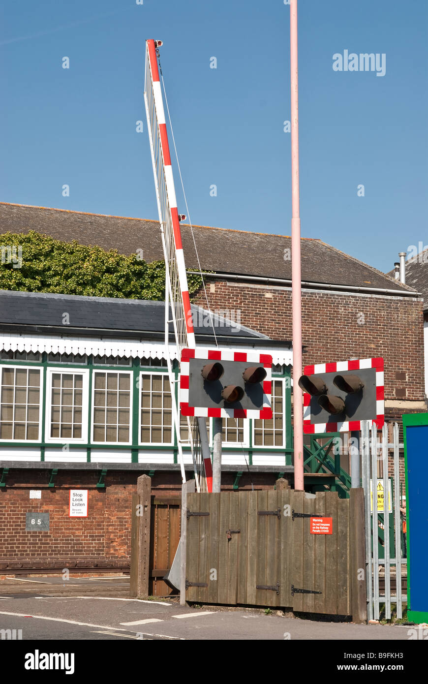 Railway signal box at railway level crossing with gates hi-res stock ...