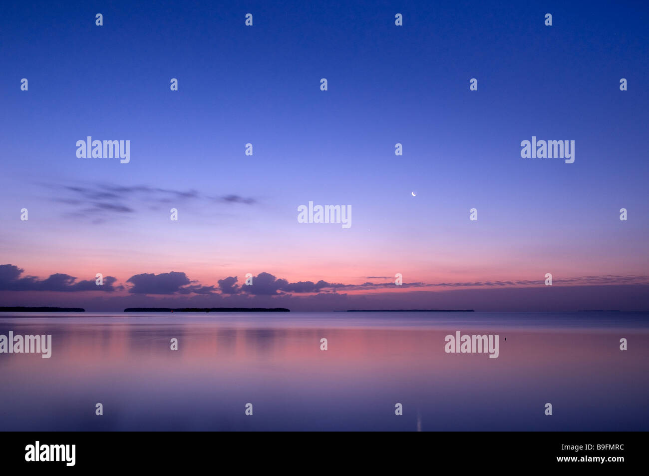 Moon sets as dawn lights mangrove islands in Florida Bay Everglades ...
