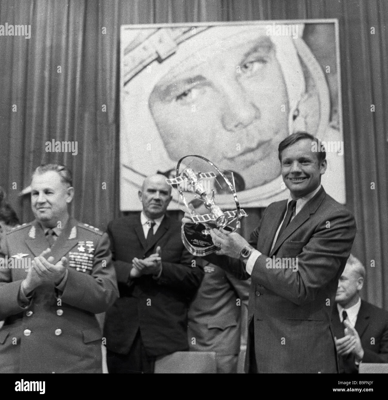 U S Astronaut Neil Armstrong right receives gift from Soviet cosmonauts ...