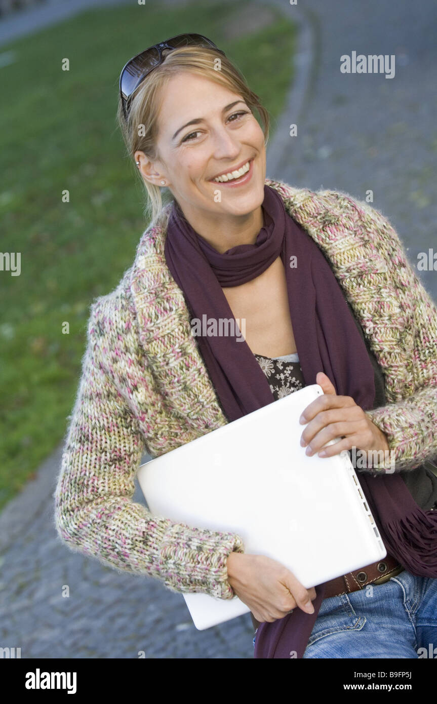 University campus woman young laptop carry semi-portrait series people ...