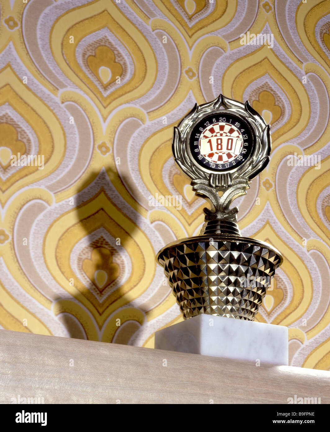 Trophy for Darts competition in a 60s/70s setting Stock Photo - Alamy
