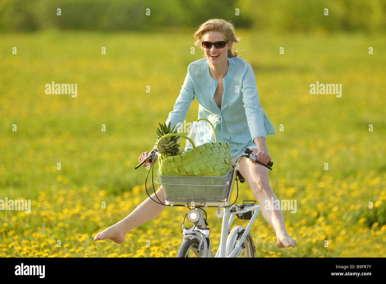 flower meadow woman barefoot bicycle cheerfully spring frolic people ...