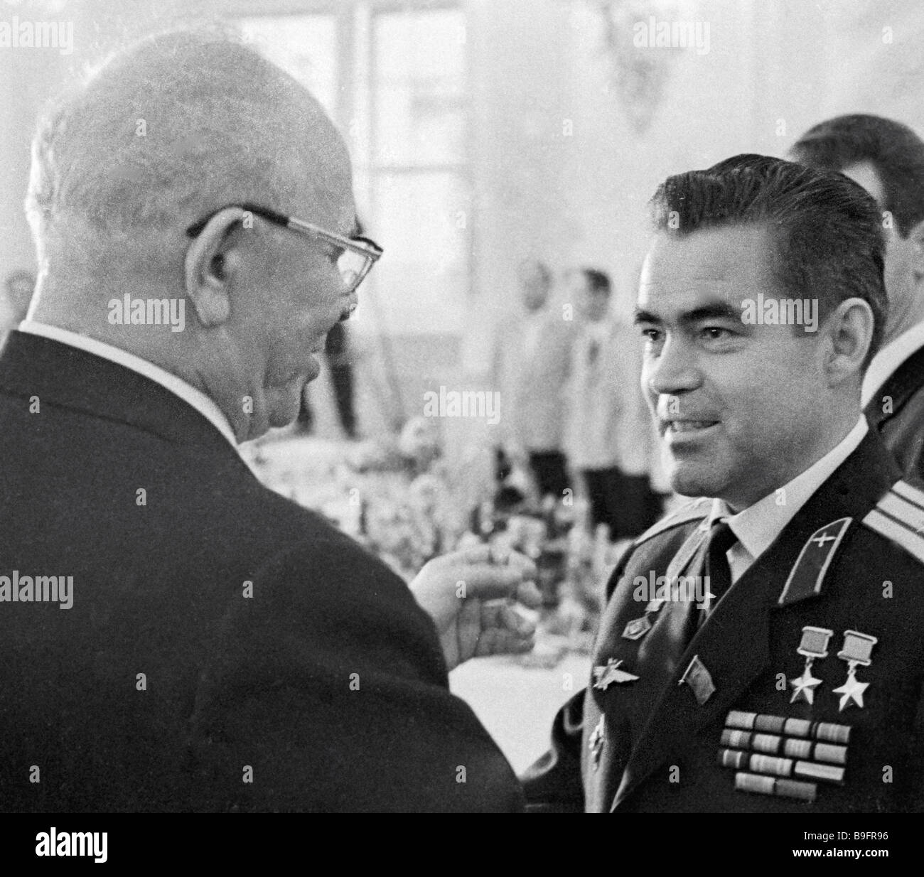 Chairman of the USSR Supreme Soviet Nikolai Podgorny left is talking to ...