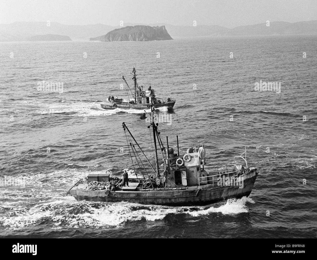 Slavyanka fish factory seiners putting to sea Stock Photo - Alamy