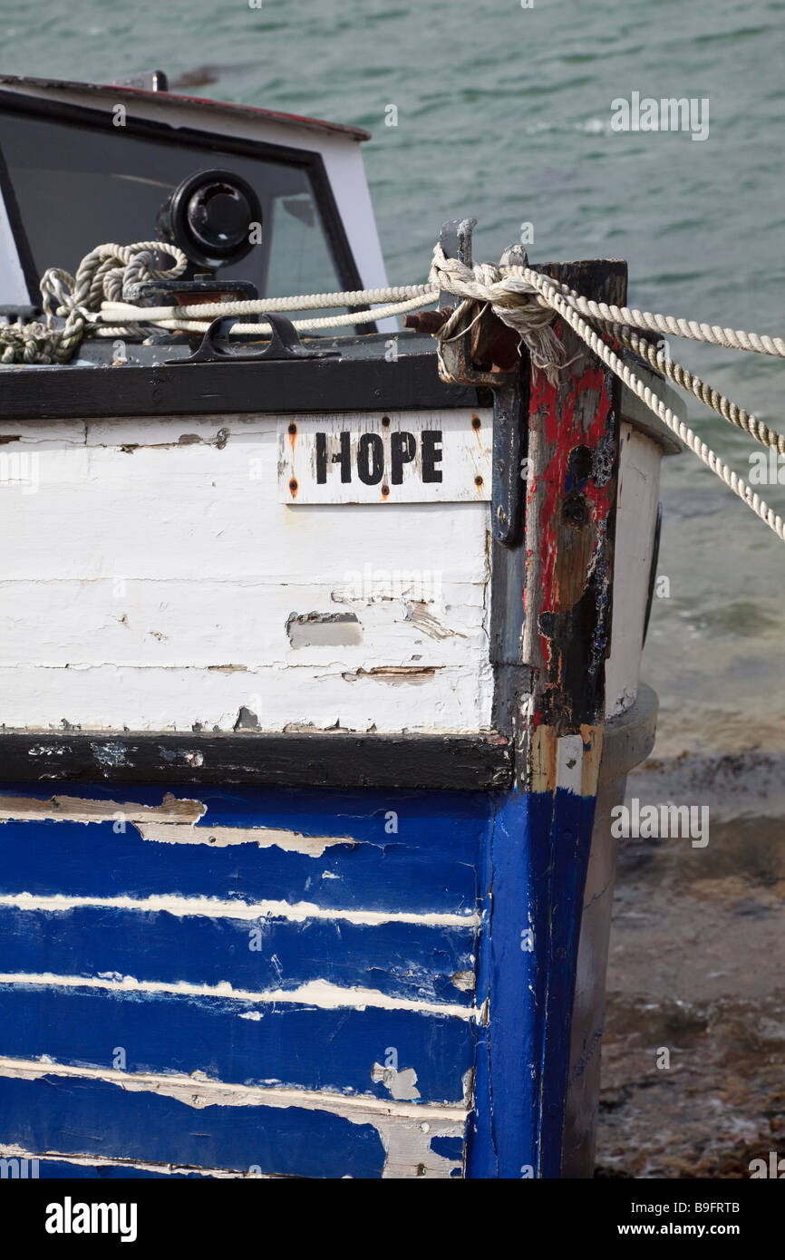 Hope A distressed motor boat moored on the beach at Eastney Stock Photo ...