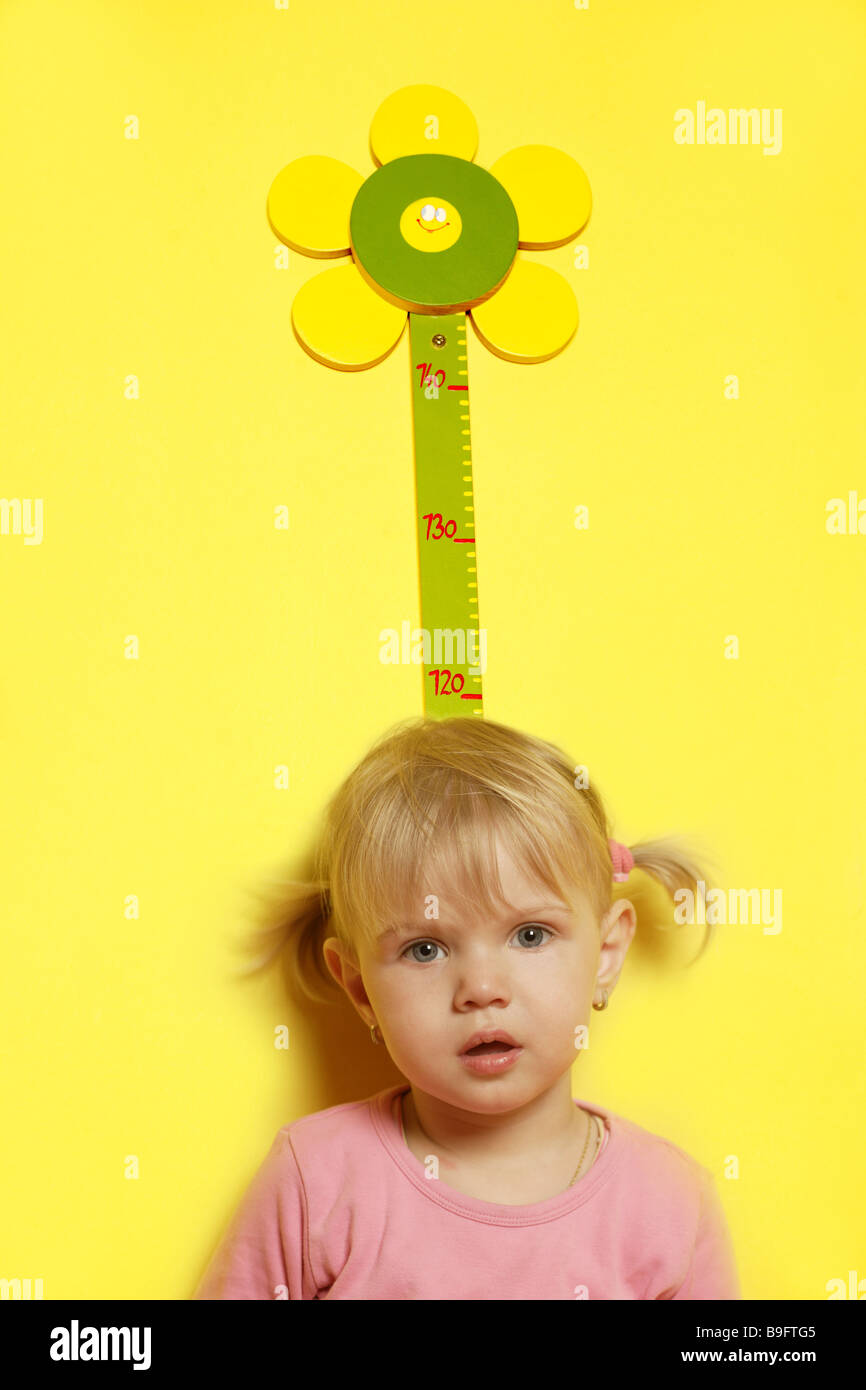girl measuring-slat height measures portrait series people child ...