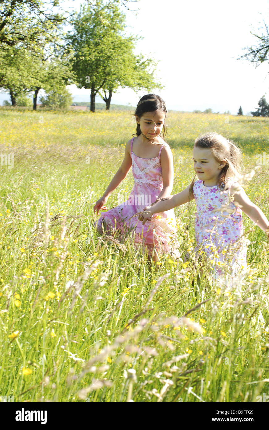 Children plays meadow Stock Photo - Alamy
