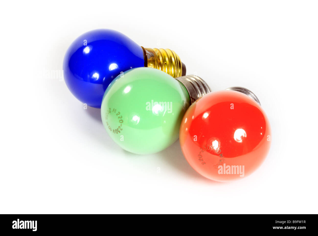 Three of different colors electric bulbs Stock Photo - Alamy